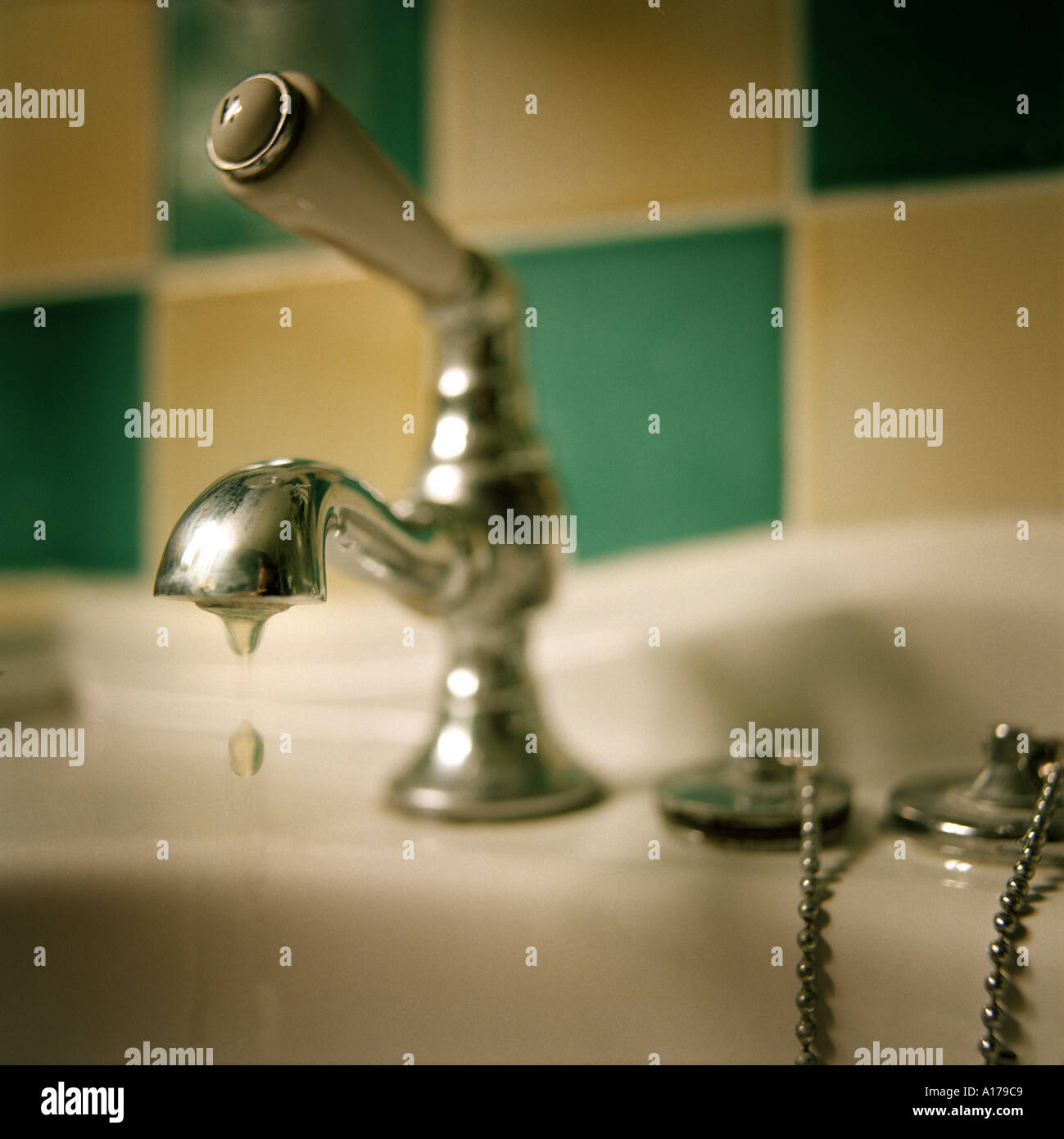 old fashioned tap dripping into basin Stock Photo - Alamy