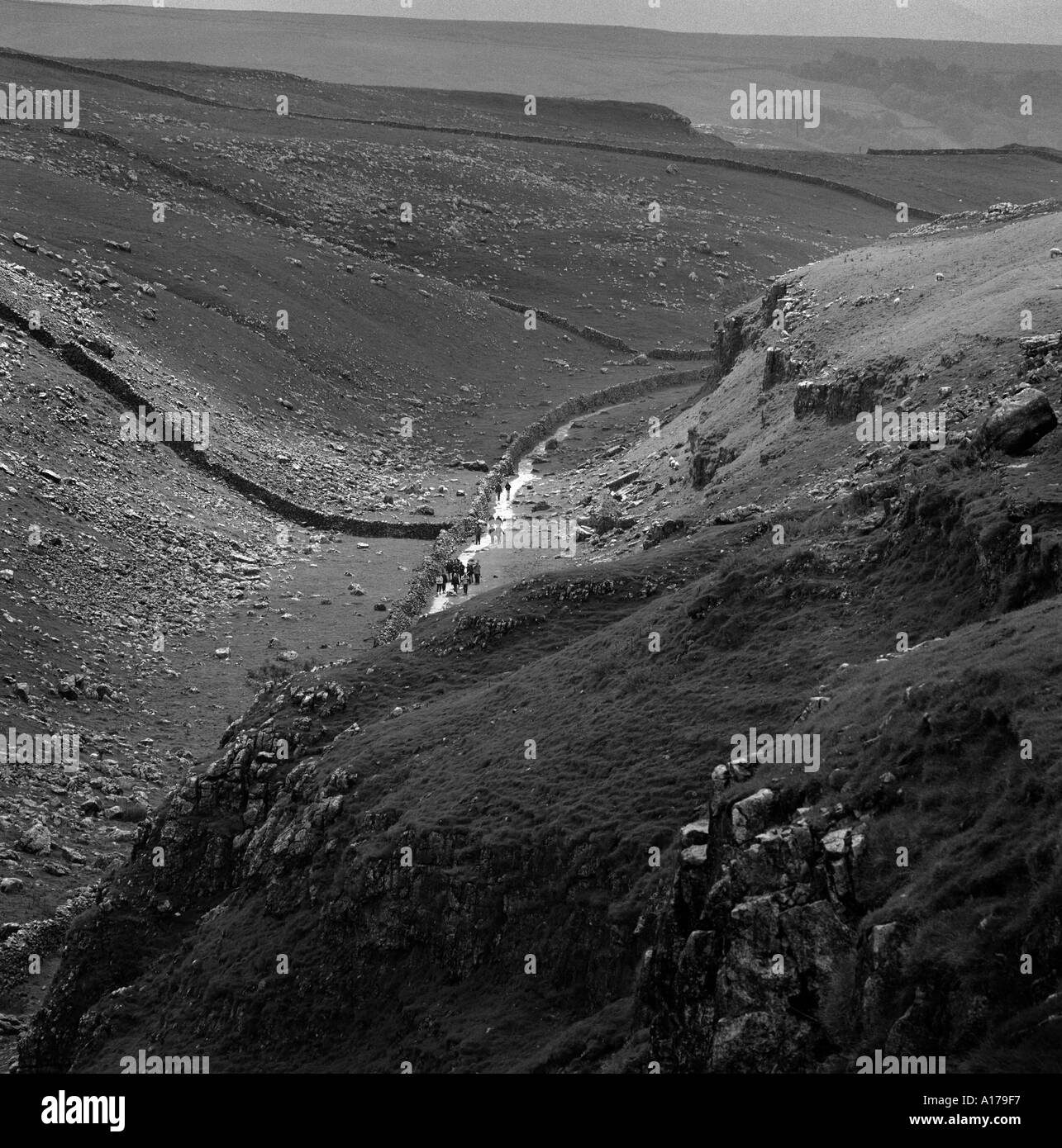 yorkshire moors walkers in big limestone pavement valley Stock Photo ...