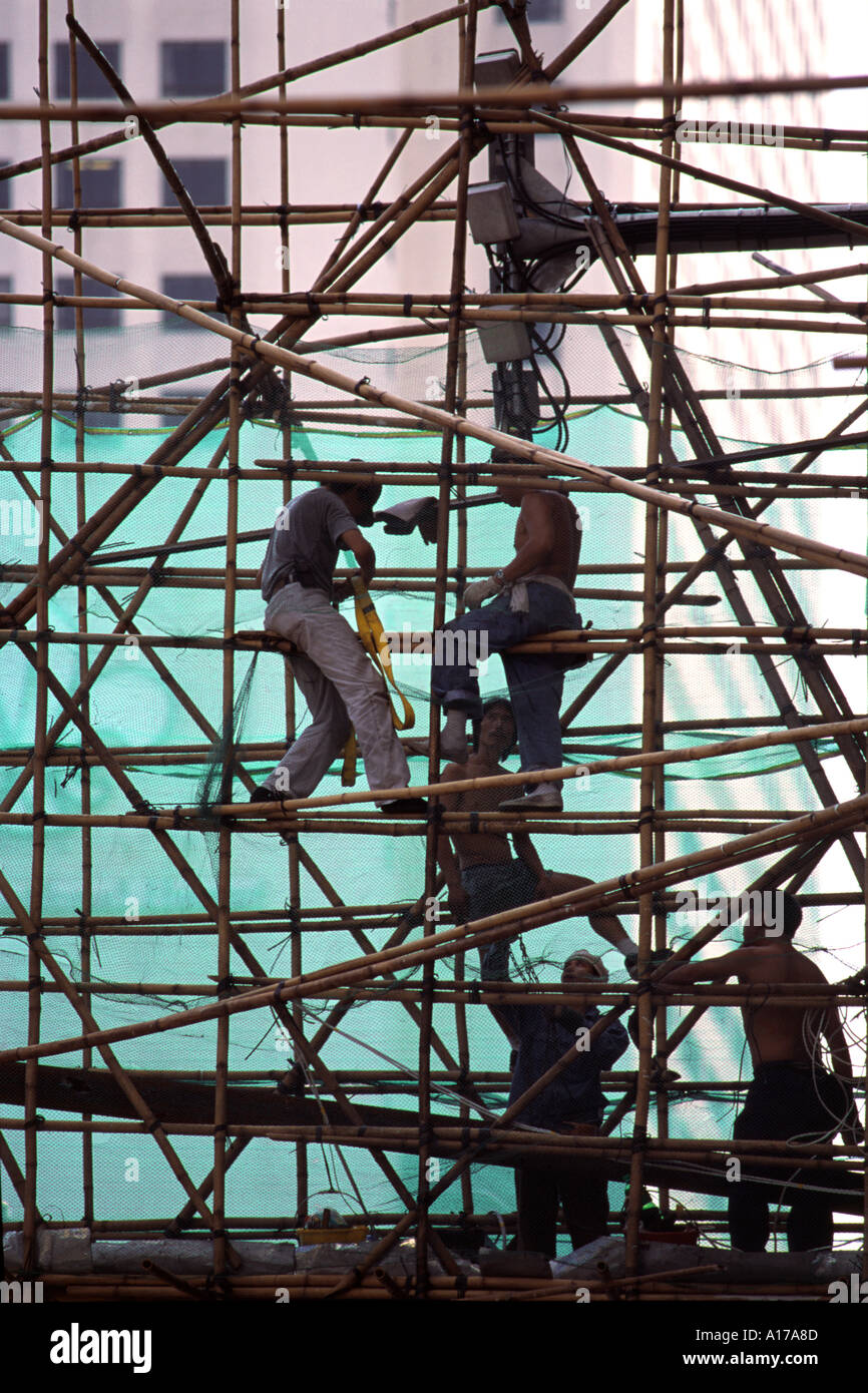 Man on a bamboo scaffolding hi-res stock photography and images - Alamy