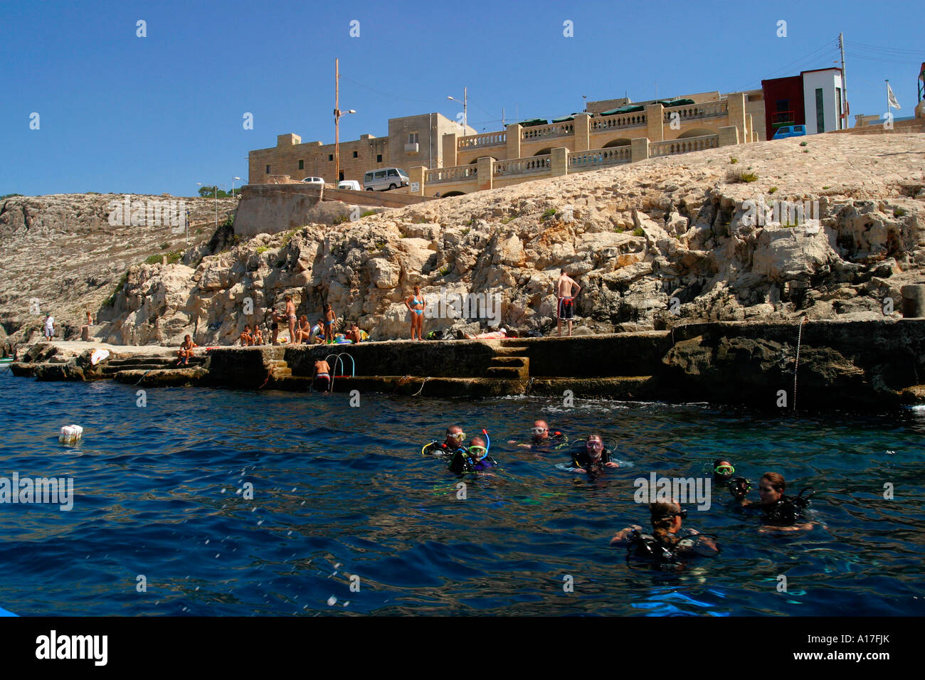 Scuba divers in the water in Malta Stock Photo - Alamy