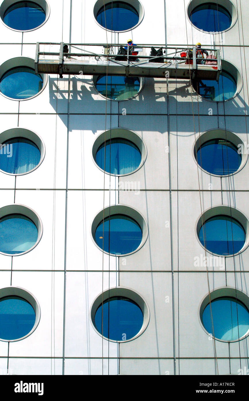 Men cleaning windows on a Tall building in Hong Kong Stock Photo - Alamy