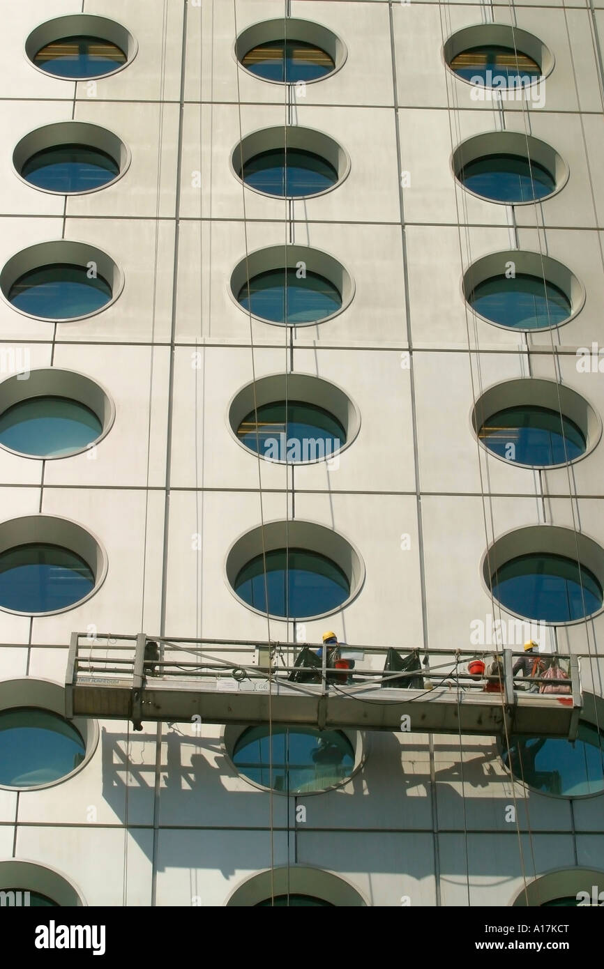 Men cleaning windows on a Tall building in Hong Kong Stock Photo - Alamy