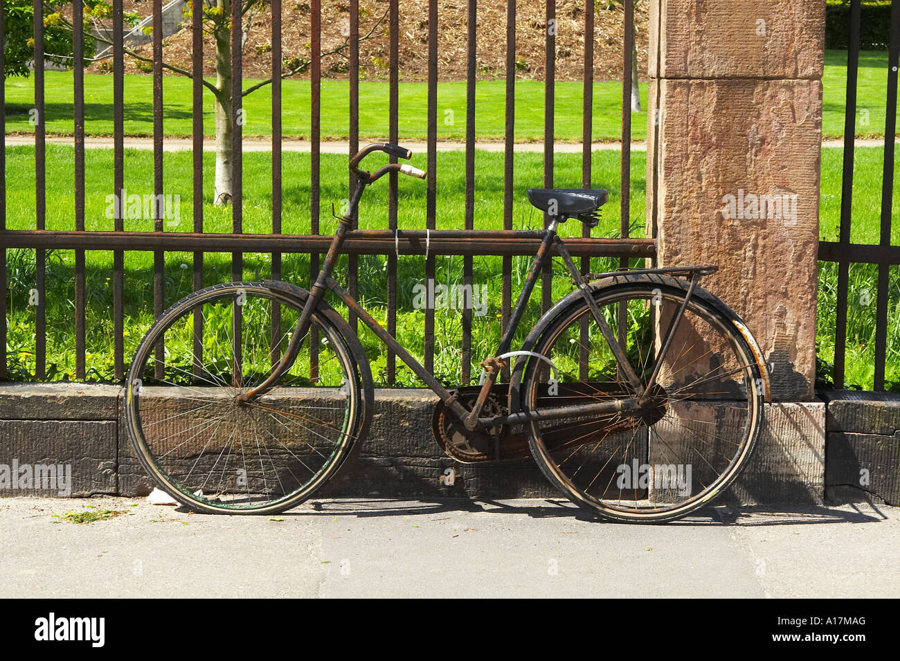 Leaning on metal barrier hi-res stock photography and images - Alamy