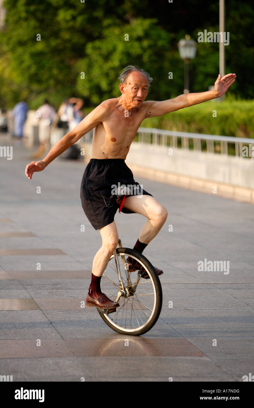 Man on unicycle hi-res stock photography and images - Alamy