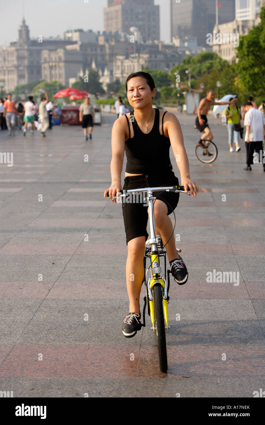 Girl on Bicycle, Early Morning, The Bund, Shanghai, China Stock Photo ...