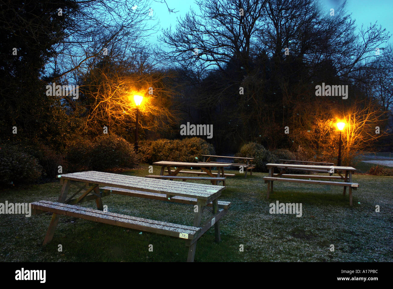 Snow covered exterior seating in English Country Pub Stock Photo - Alamy