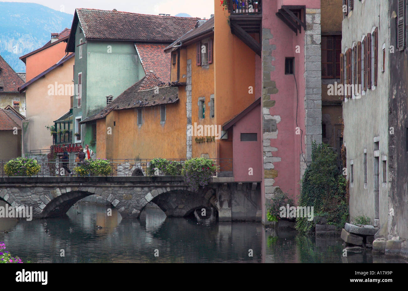 Waterfront buildings and a bridge over the river Thiou in Annecy in ...