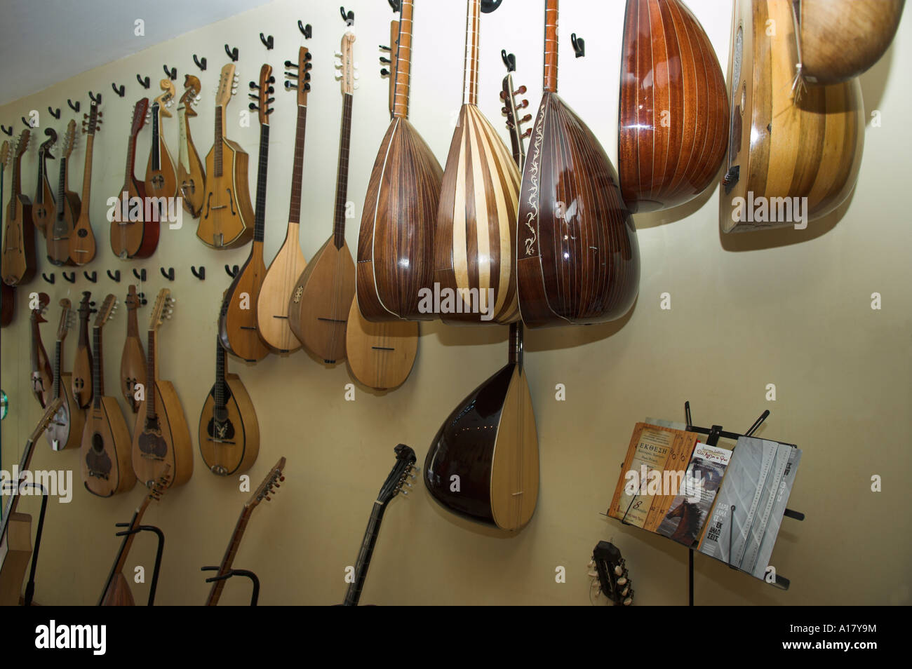 Stringed musical instruments displayed in shop Stock Photo - Alamy