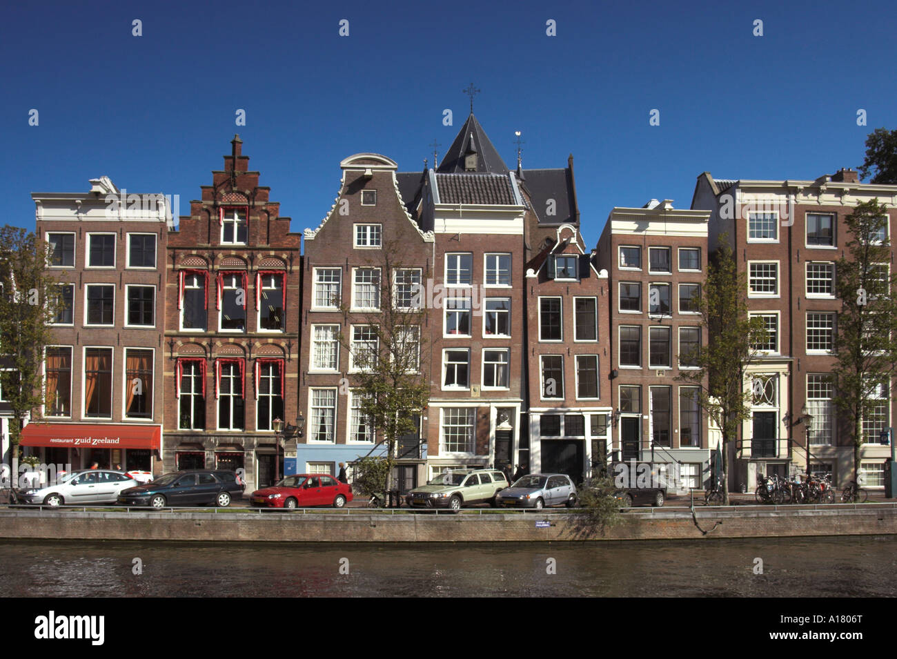 horizontal landscape photo of dutch houses alongside the herengracht ...