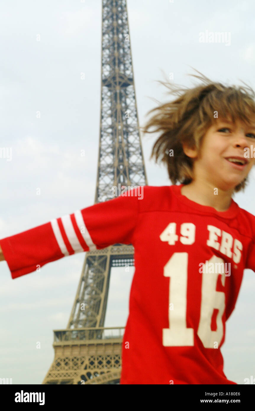 Boy in front of the Eiffel tower Paris Stock Photo - Alamy