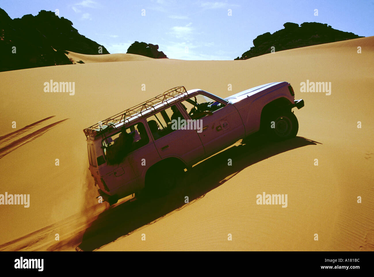Libya desert Sahara sand dune jeep offroad driving Toyota uphill four ...