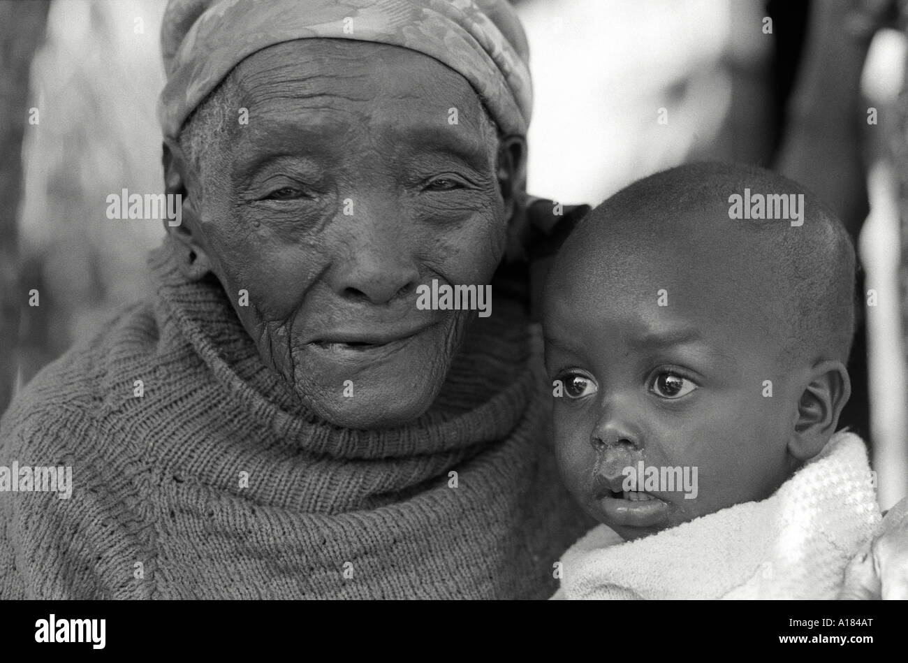 B/W portrait of an elderly woman and her great-grandchild from the ...