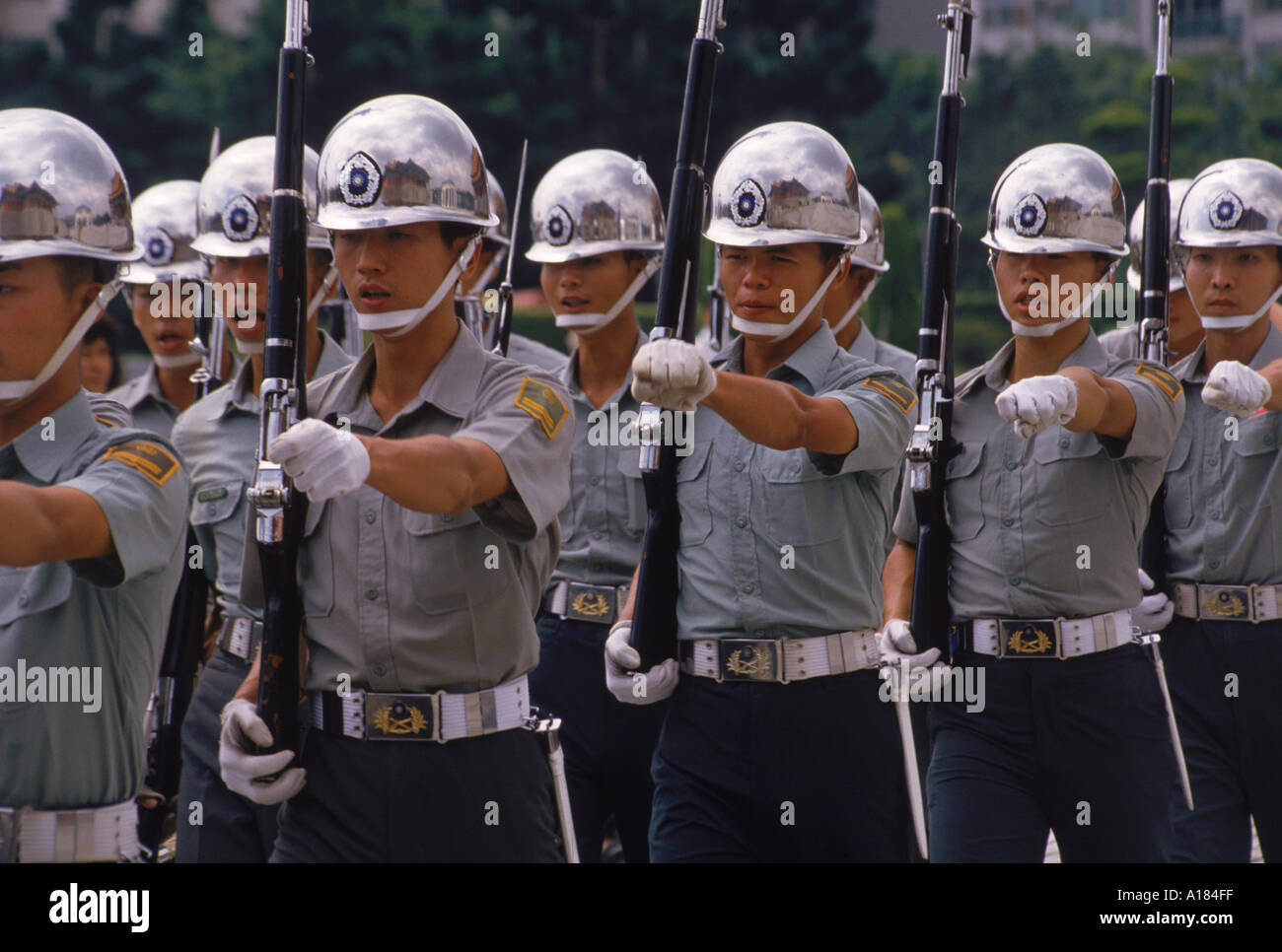 Military cadets with shiny helmets marching in Taipei Taiwan Asia G ...