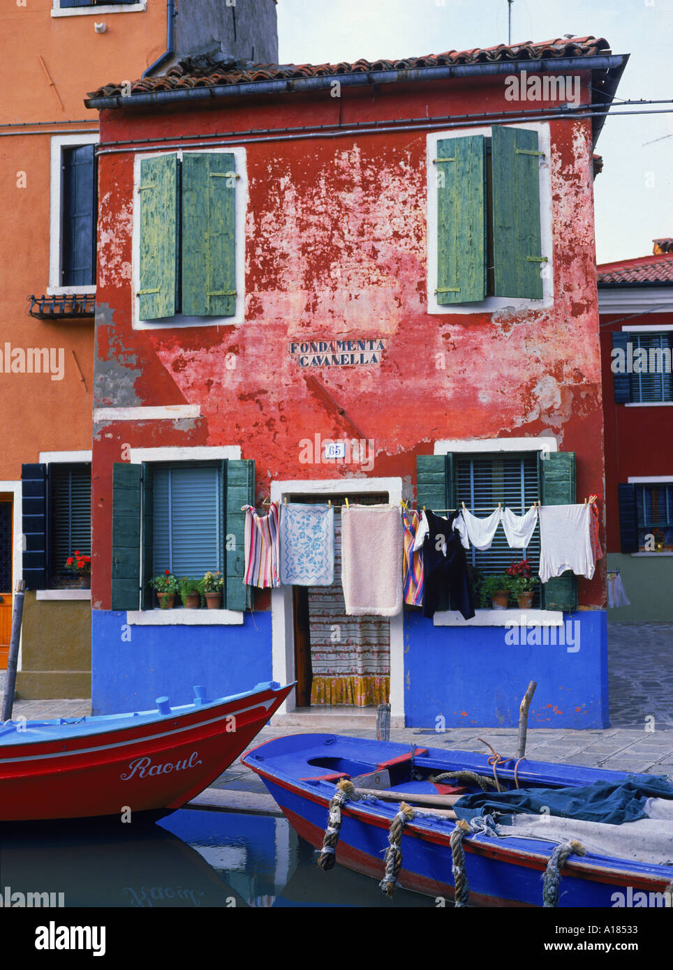 A typical canal side house with washing line in Burano Veneto Italy ...
