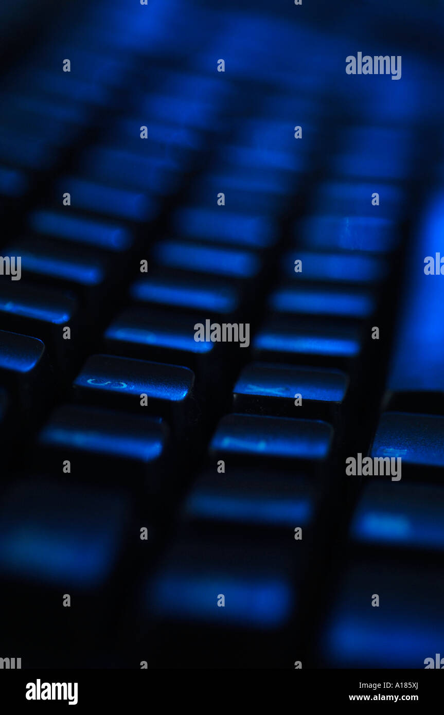 Computer Keyboard with blue lighting Stock Photo - Alamy
