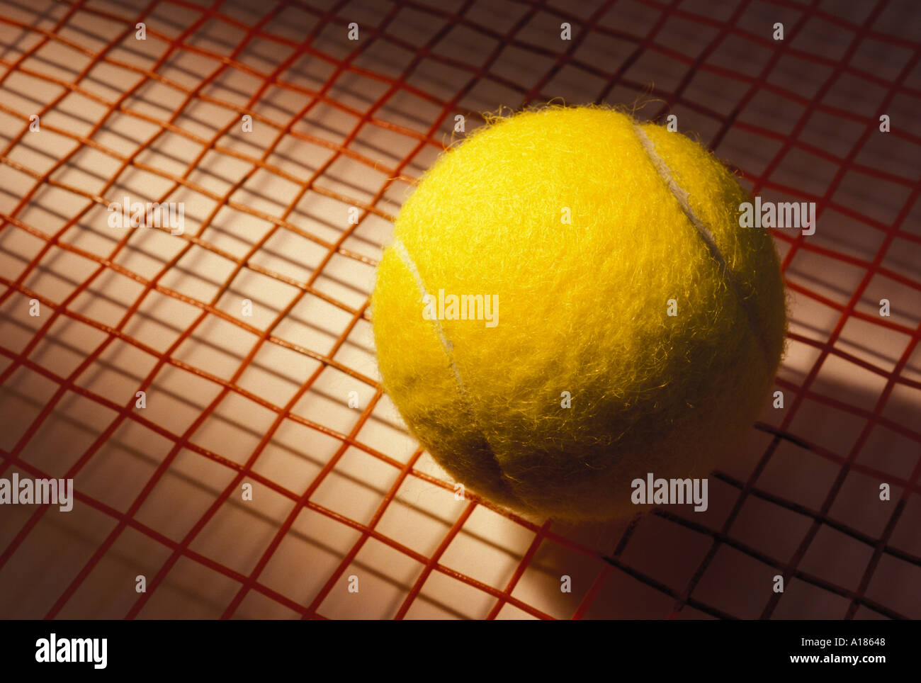 Tennis ball on racket Stock Photo - Alamy