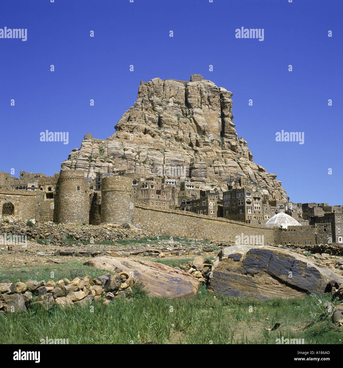 Walls and city below fortress on top of the mountain at Thulla Yemen ...
