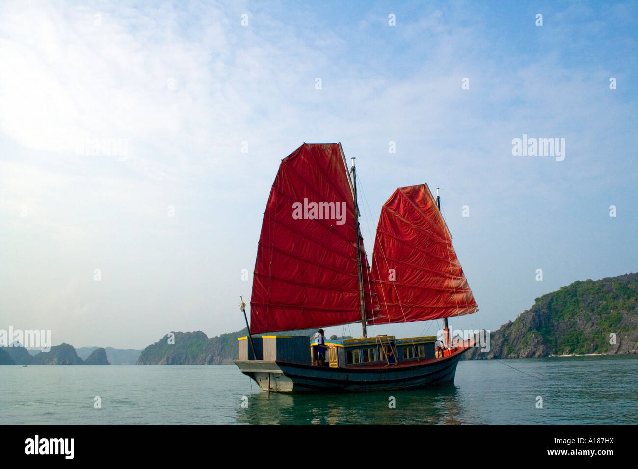 Traditional Vietnamese Sailing Junk Set against Limestone Karst ...