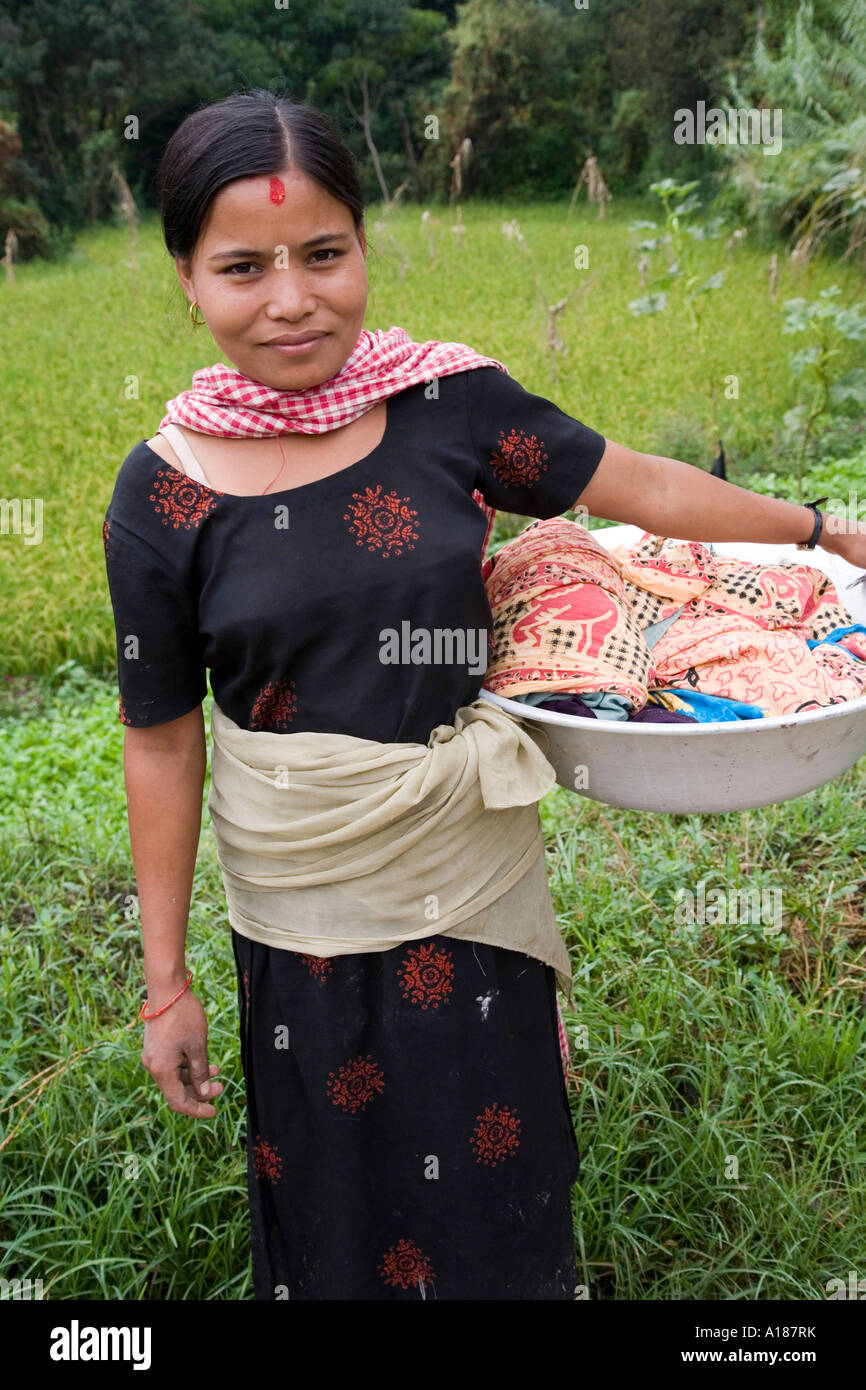 Nawari girl with wash in Nepal Stock Photo - Alamy