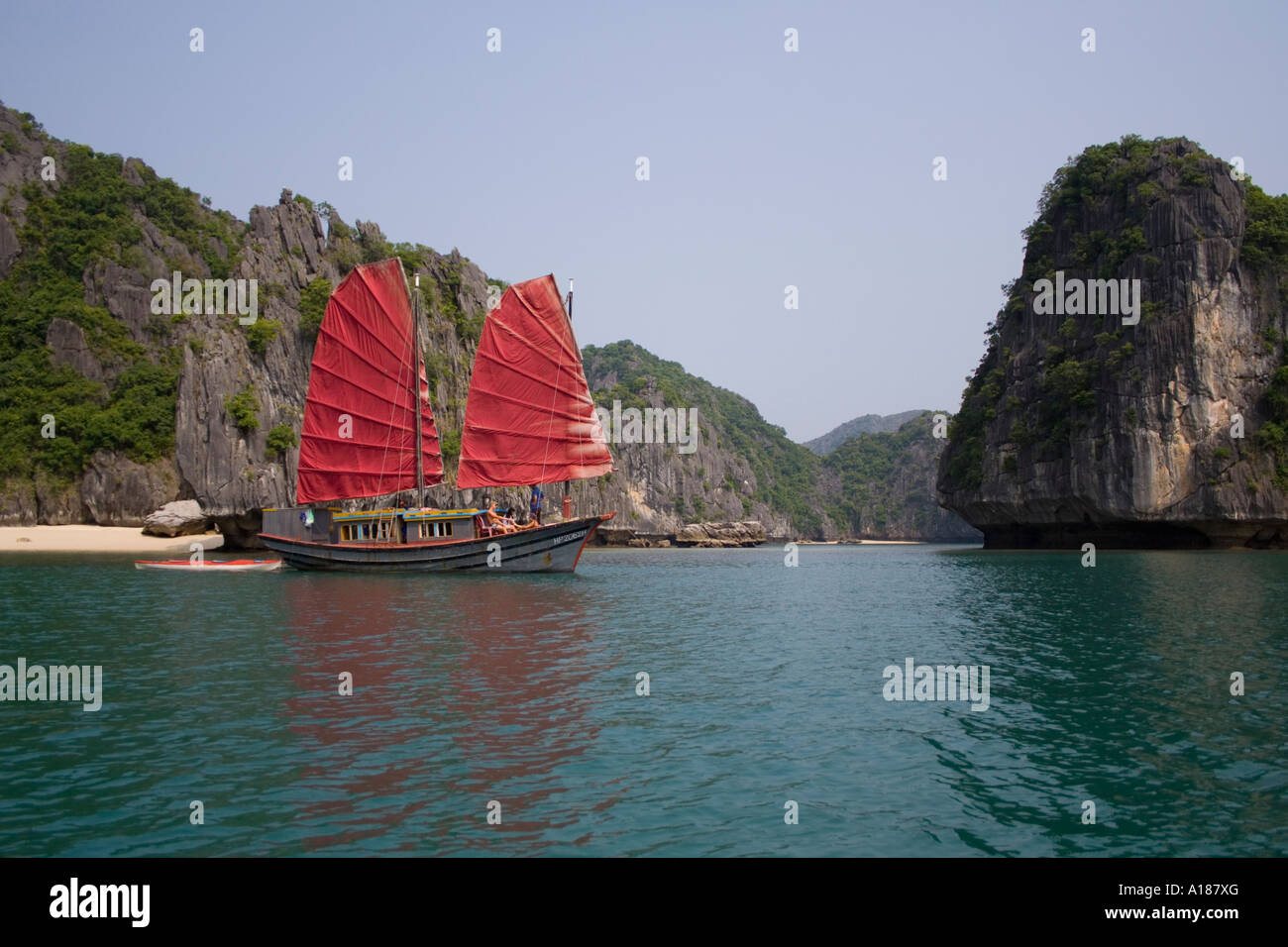 Traditional Vietnamese Sailing Junk Set against Limestone Karst ...