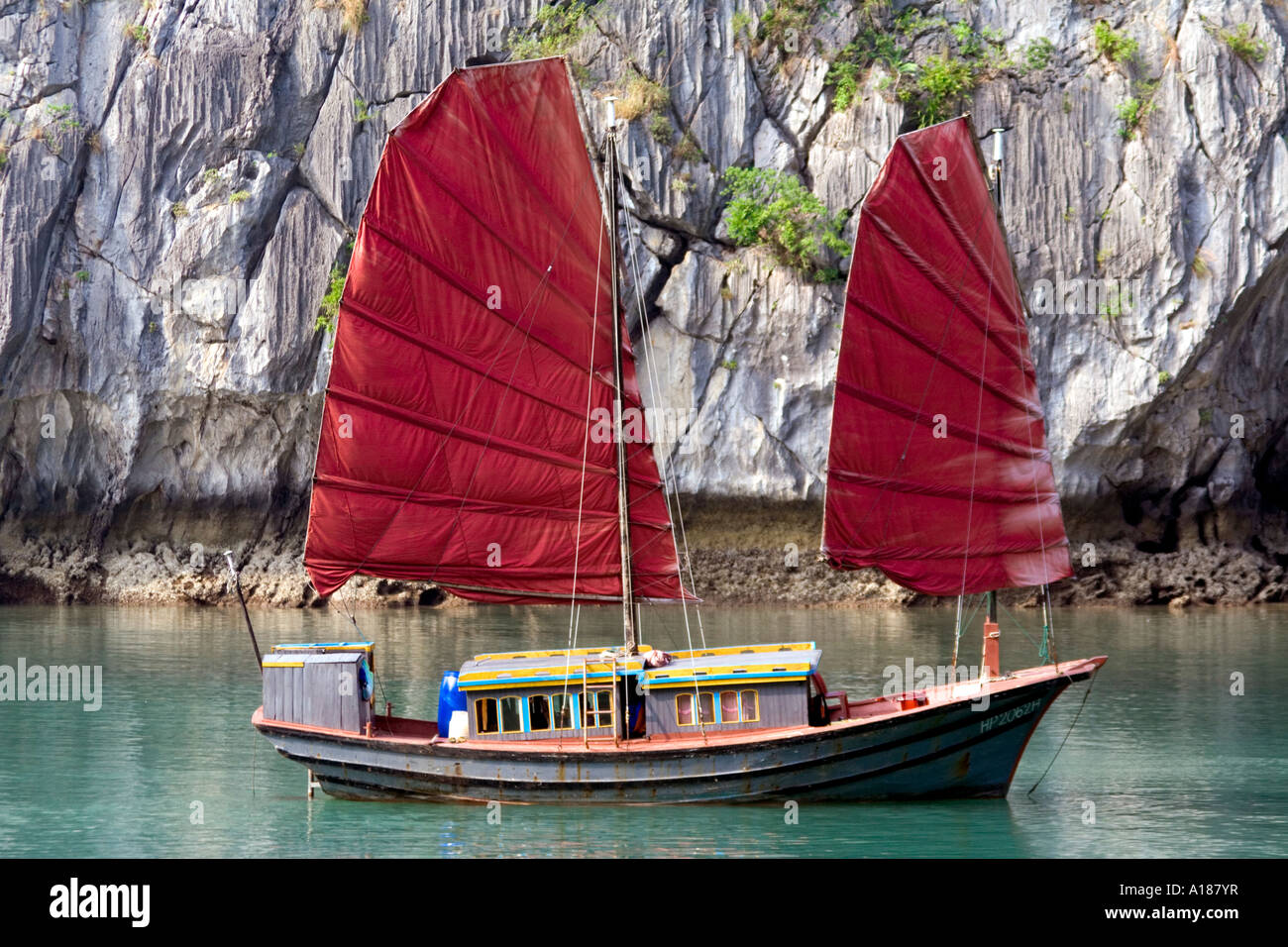 2007 Traditional Vietnamese Sailing Junk Set against Limestone Karst ...
