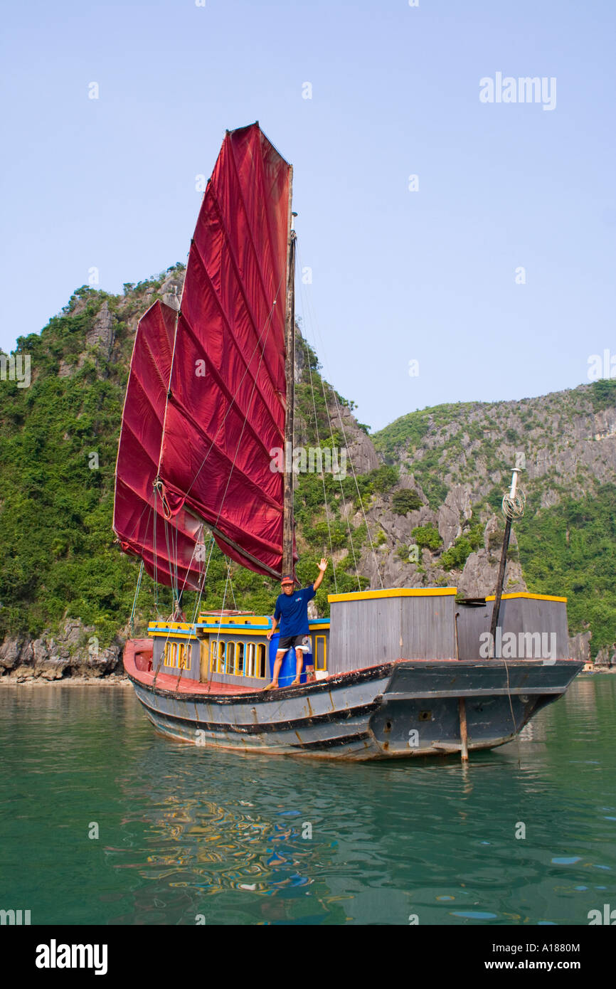 Traditional Vietnamese Sailing Junk Set against Limestone Karst ...