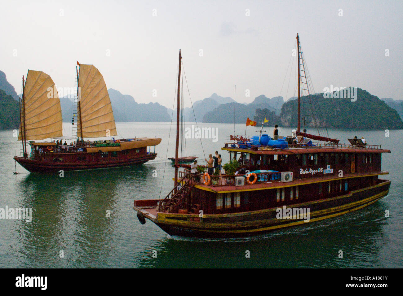 Traditional Vietnamese Sailing Junk Set against Limestone Karst ...