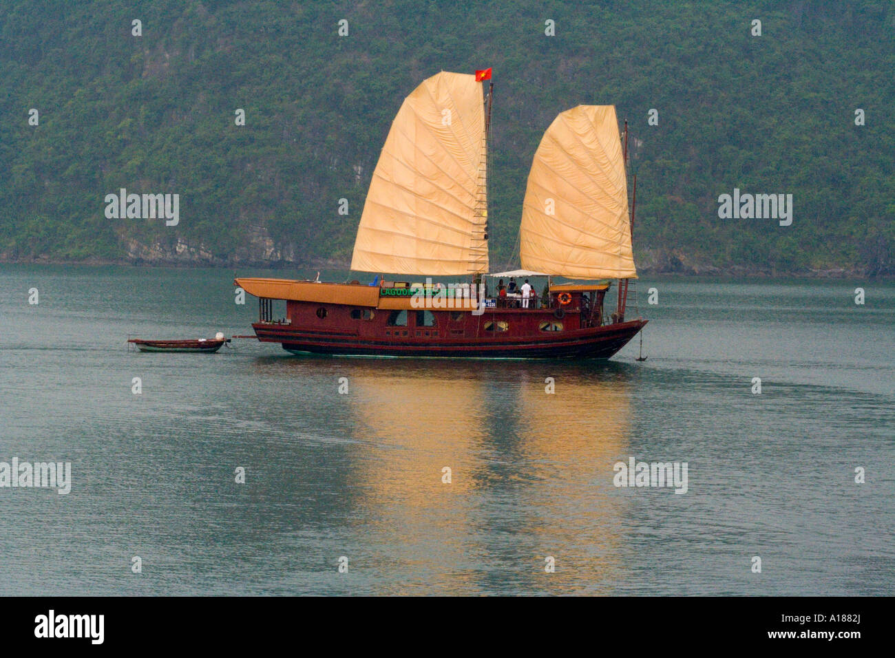 Traditional Vietnamese Sailing Junk Set against Limestone Karst ...