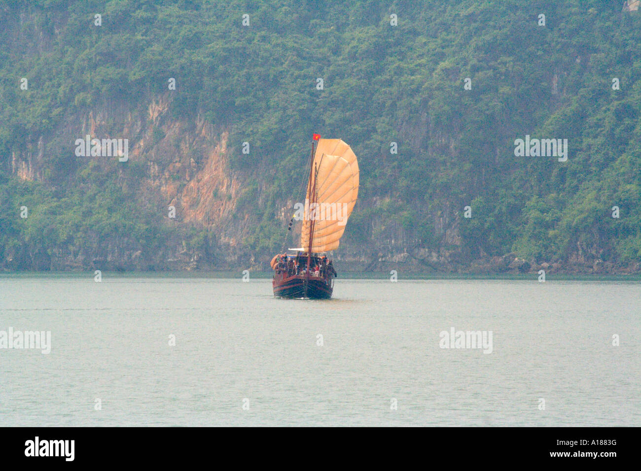 Traditional Vietnamese Sailing Junk Set against Limestone Karst ...