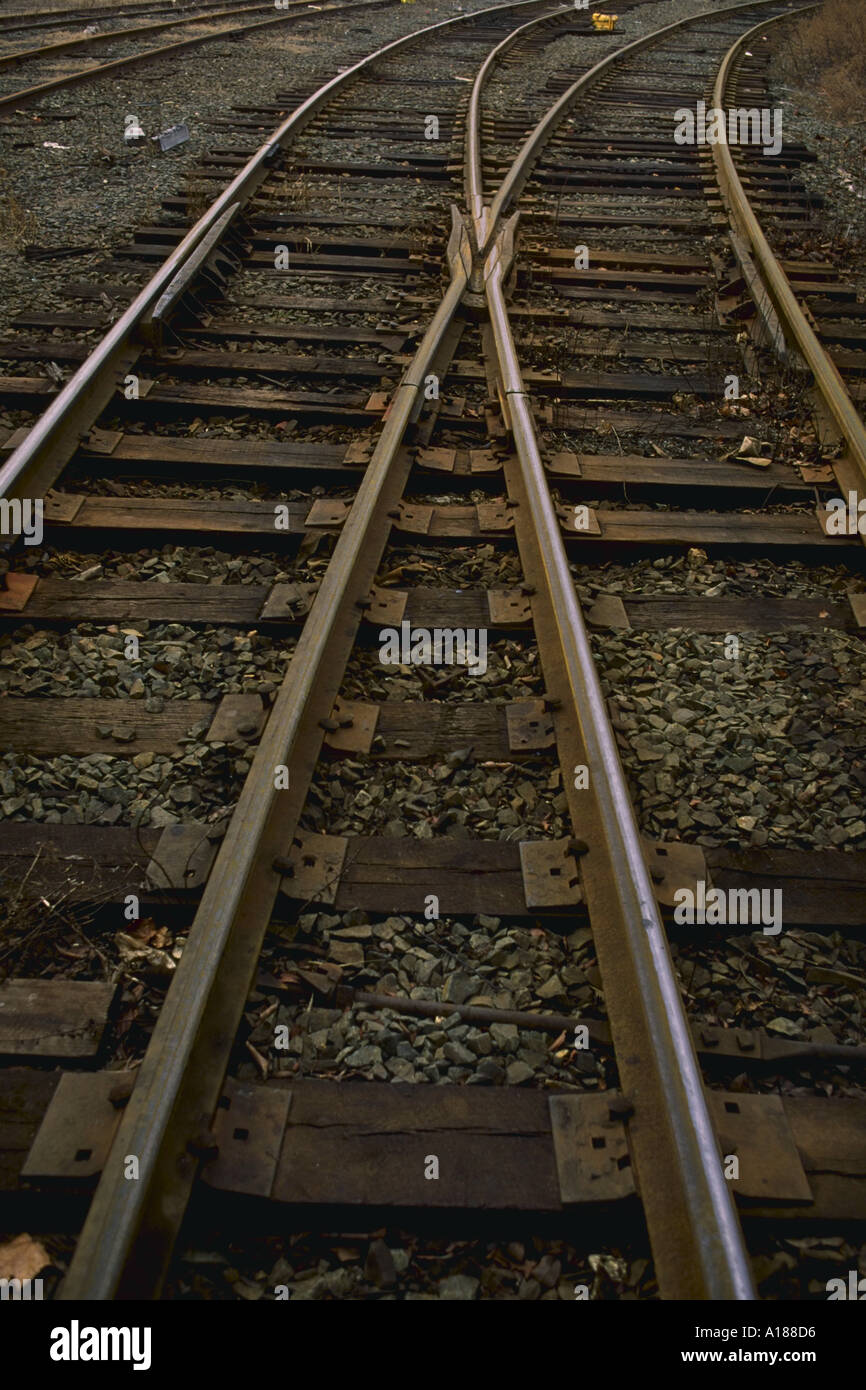 Railroad tracks converging Stock Photo - Alamy