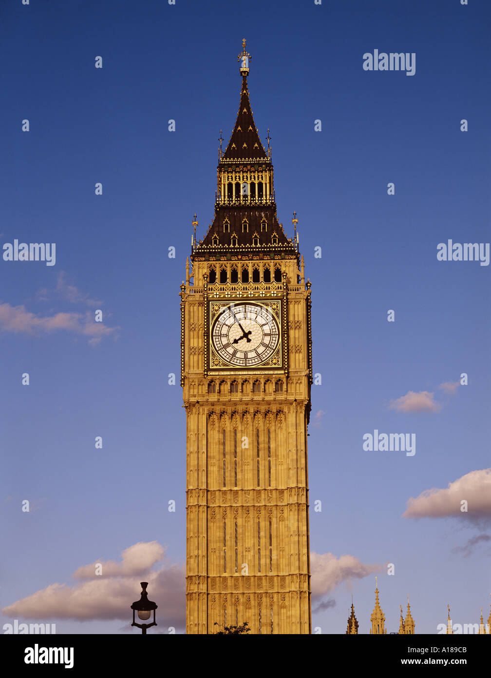 London. England. The Clock Tower at the Houses of Parliament holding ...