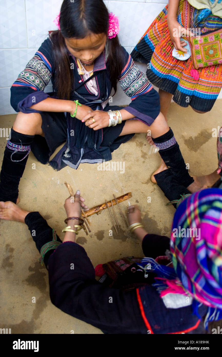 Hmong Girls In Traditional Dress Play a Game with Sticks Sapa Vietnam ...
