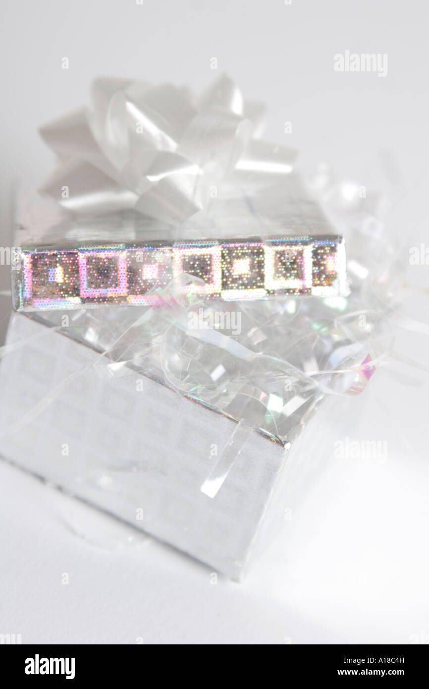 small silver gift with white bow Stock Photo - Alamy