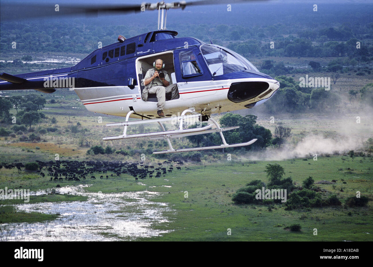 Steve Bloom photographing from a helicopter over the Okavango in ...