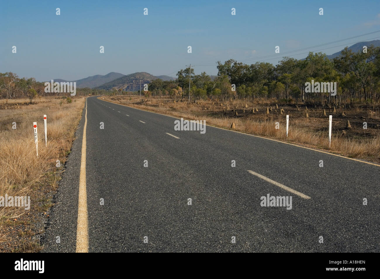 Road with Termite mounds beside it Mount Carbine Queensland Stock Photo ...