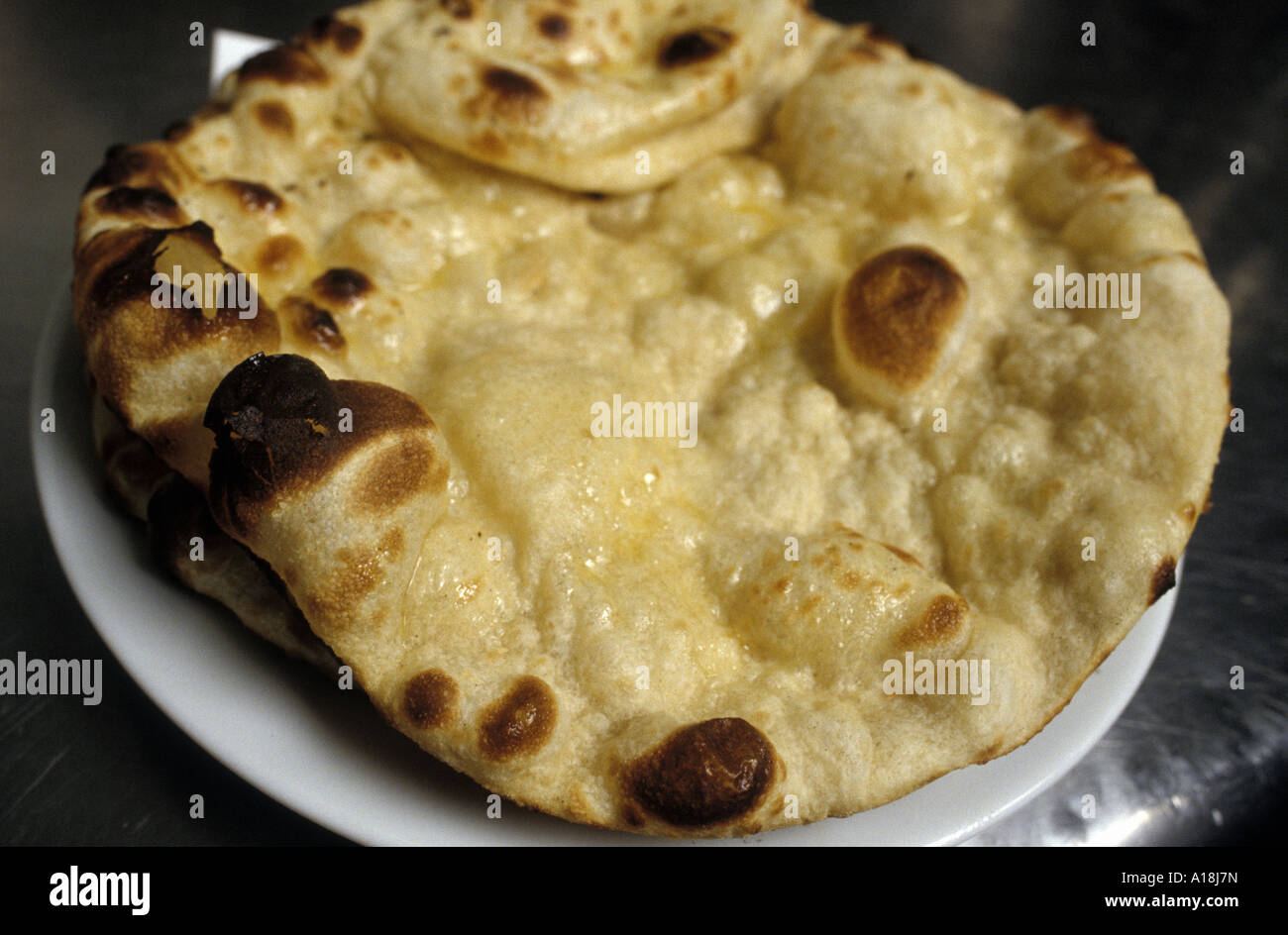 Indian naan flat bread side order hi-res stock photography and images ...