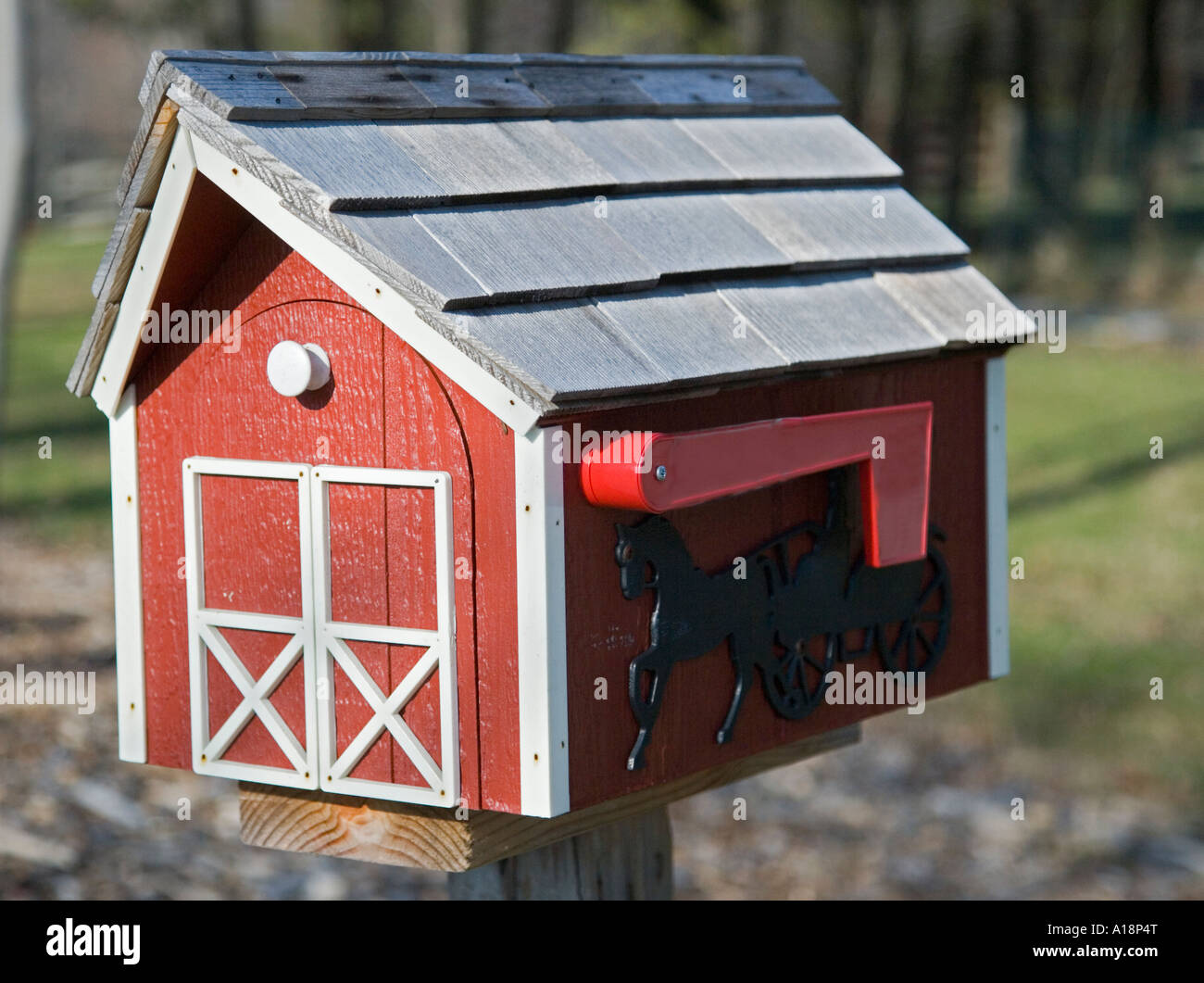 Mailbox shaped like a barn Stock Photo - Alamy