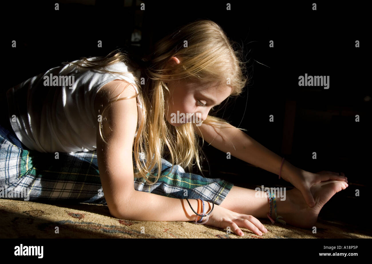 Child stretching to touch her toes Stock Photo - Alamy