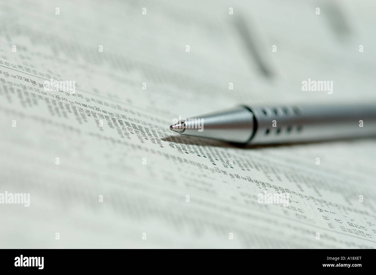 Close up of ballpoint pen on newspaper business concept Stock Photo - Alamy