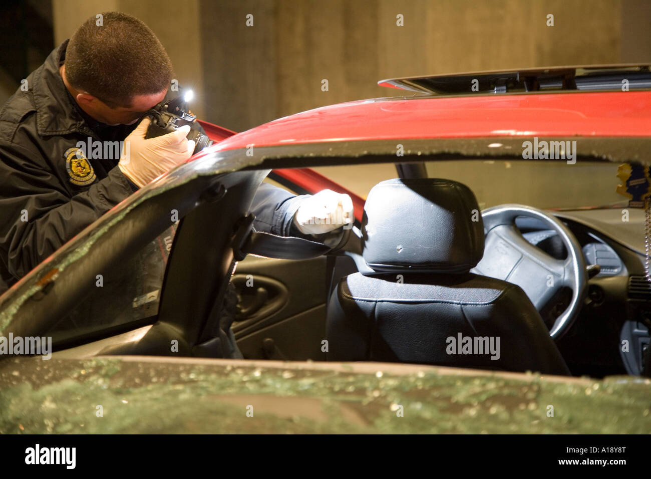 Crime Scene Technician collecting evidence at the scene of a shooting ...