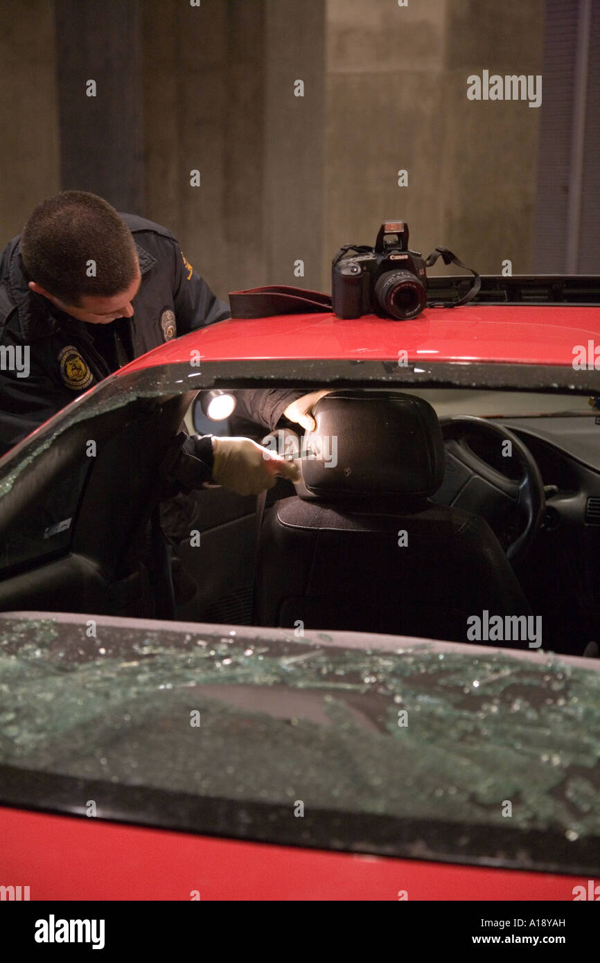 Crime Scene Technician collecting evidence at the scene of a shooting ...