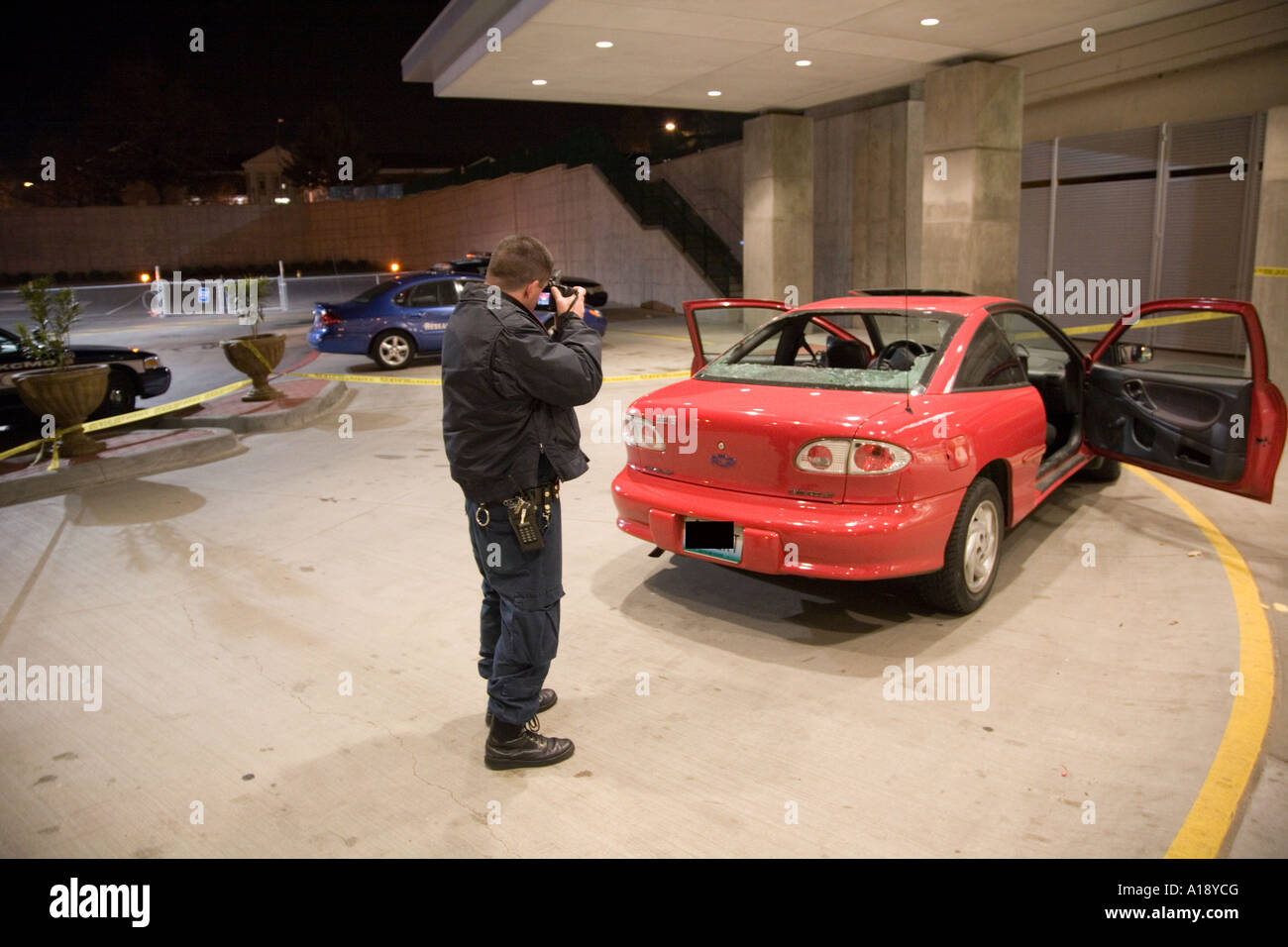 Crime Scene Technician collecting evidence at the scene of a shooting ...