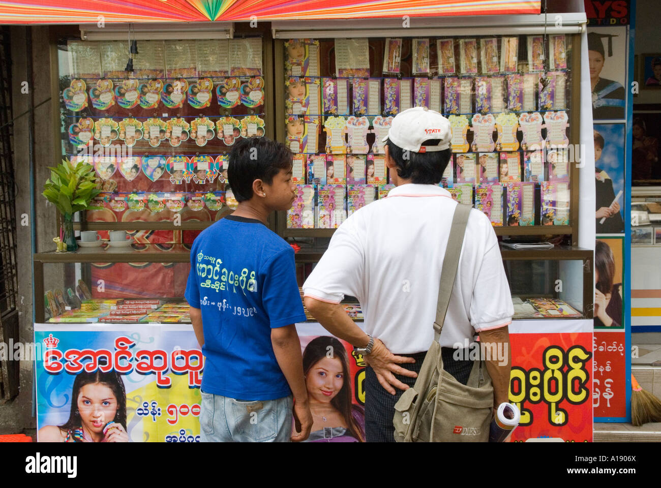 Young men at a lottery kiosk Yangon Myanmar Stock Photo - Alamy