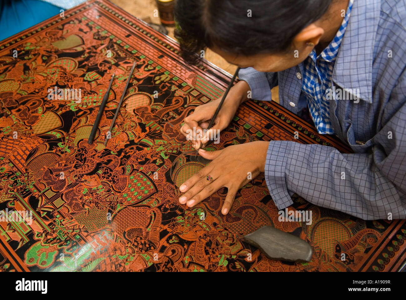 Woman working in a laquerware handicraft factory Myin Ka Ba village ...