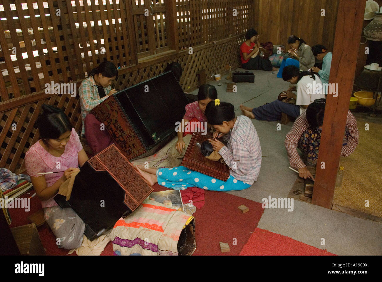 Women working in a laquerware handicraft factory Myin Ka Ba village ...