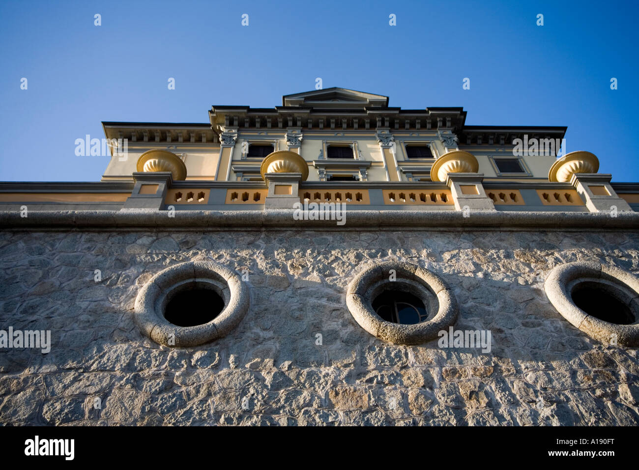 Beautiful palace with round windows underneath Stock Photo - Alamy