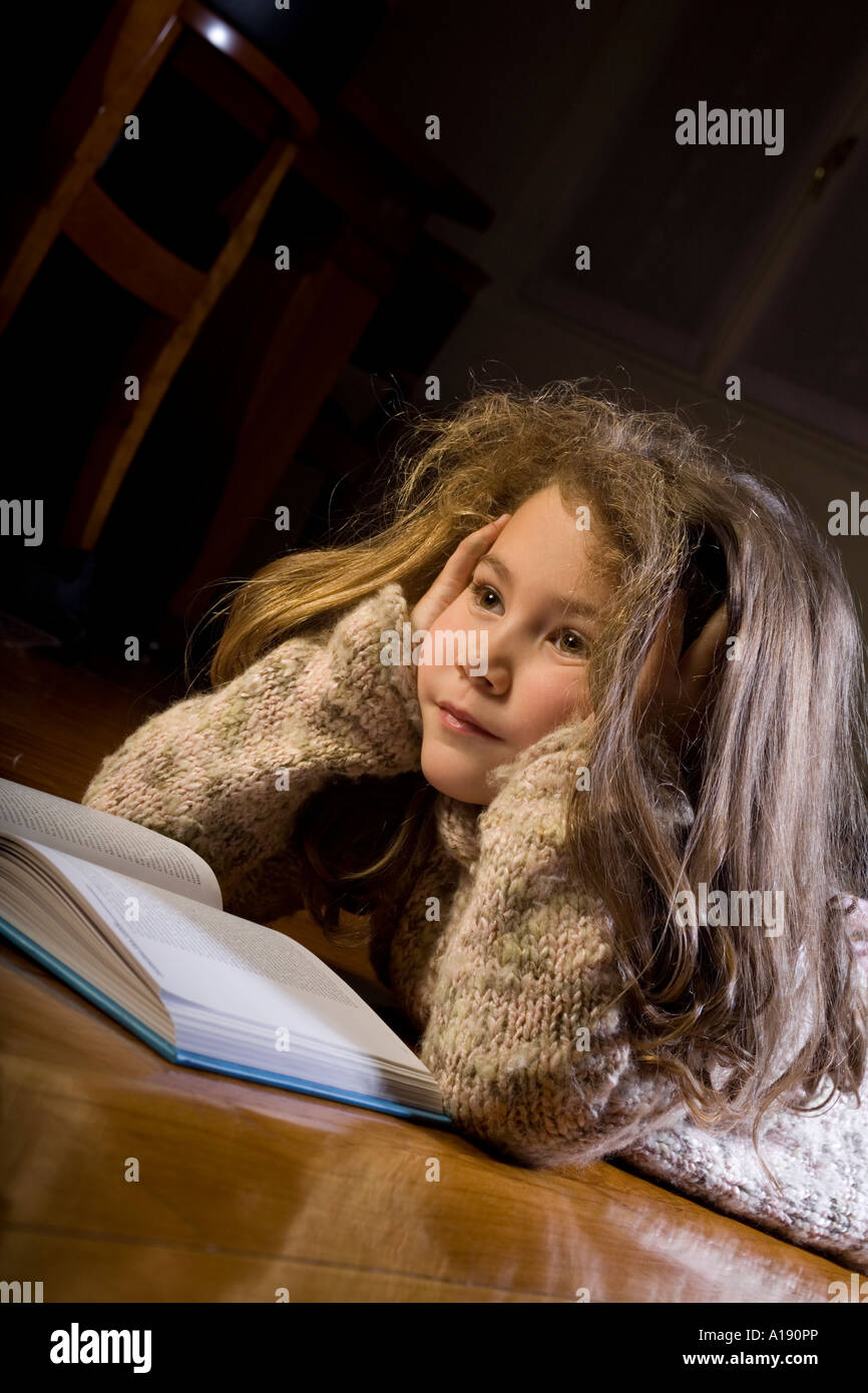 Pretty child learning her lesson by heart Stock Photo - Alamy