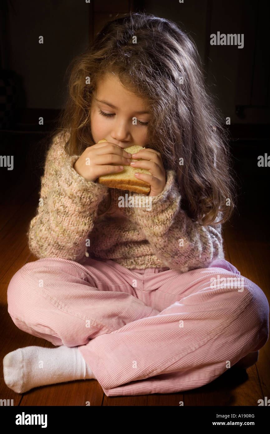 Hungry child having a sandwich Stock Photo - Alamy