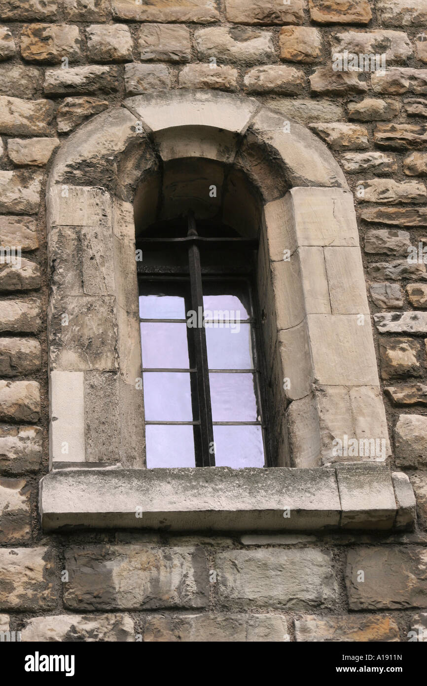 Exterior of old arch window set in stone wall in London, England Stock ...