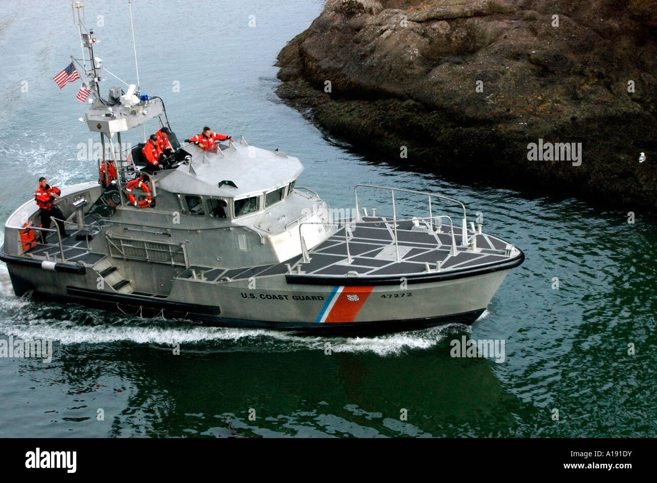 A Coast Guard patrol boat leaves the tiny harbor at Depot Bay on Oregon ...